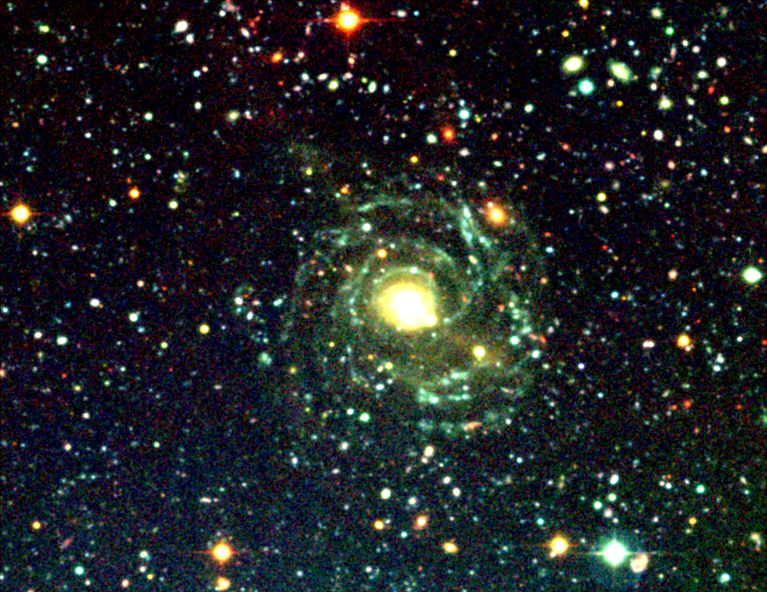 The Universe’s faintest giant grows by devouring its neighbours